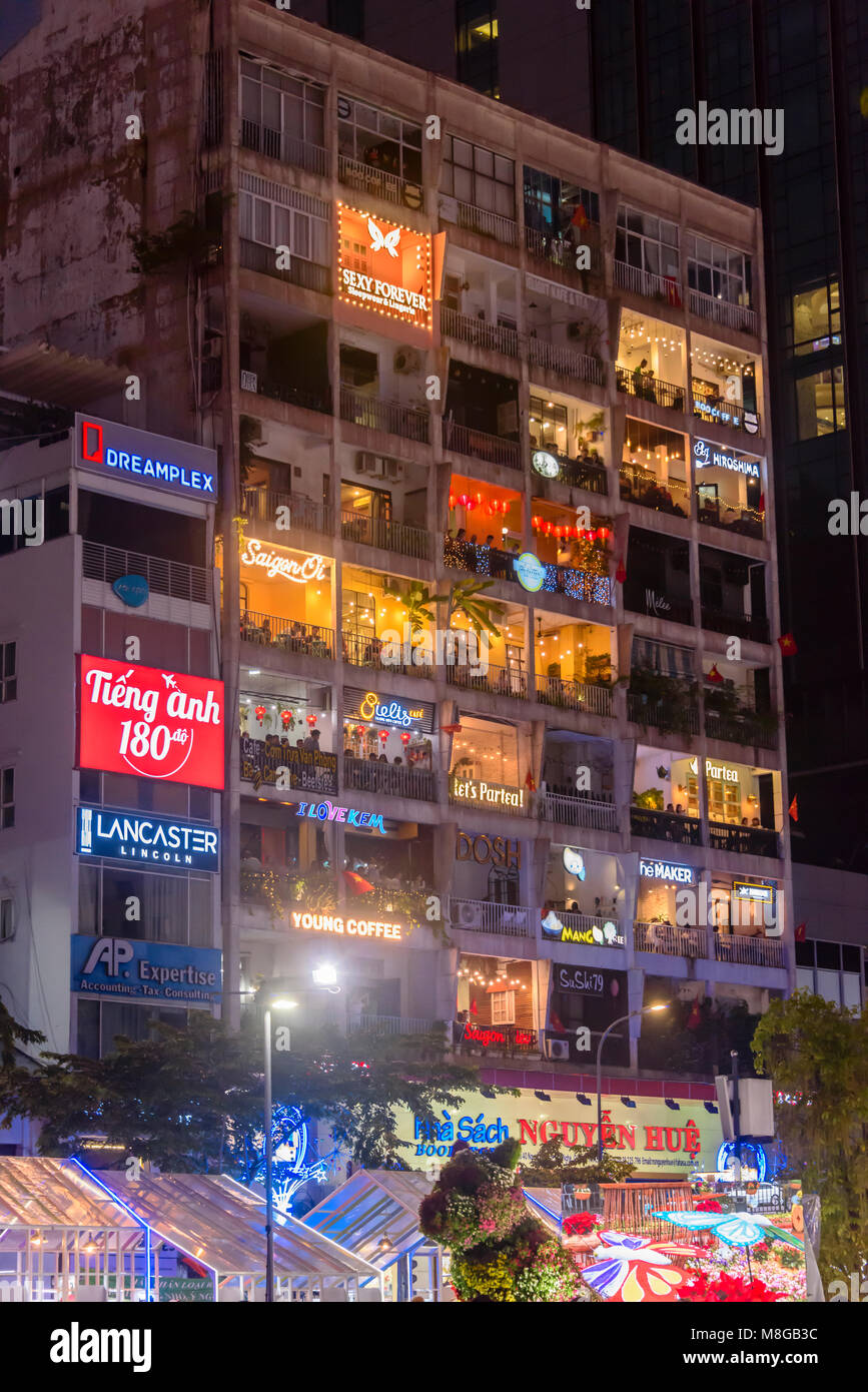 Illuminated signs for businesses in a building, Ho Chi Minh City ...