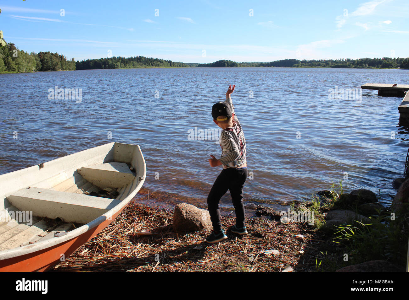 Kid throwing rocks hi-res stock photography and images - Alamy