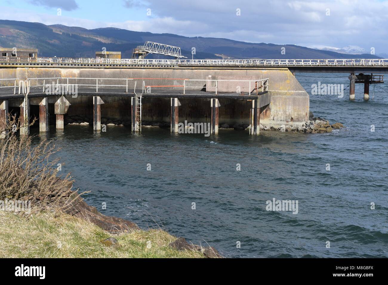 Industrial jetties at the former Inverkip power station Stock Photo - Alamy