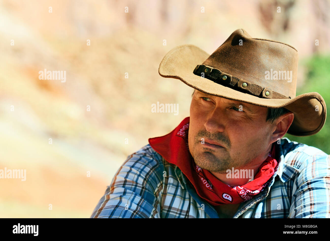 OUT WEST - A cowboy takes time to rest and reflect Stock Photo - Alamy