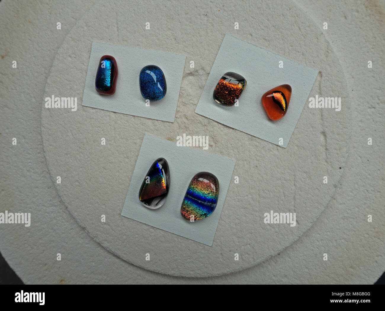 Glass fusing examples of capped and uncapped dichroic glass Stock Photo ...
