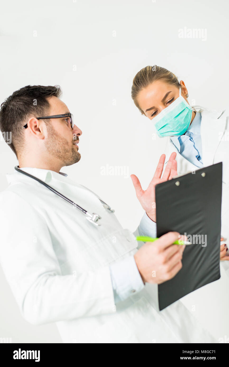 Young doctors with medical file in the hospital Stock Photo - Alamy