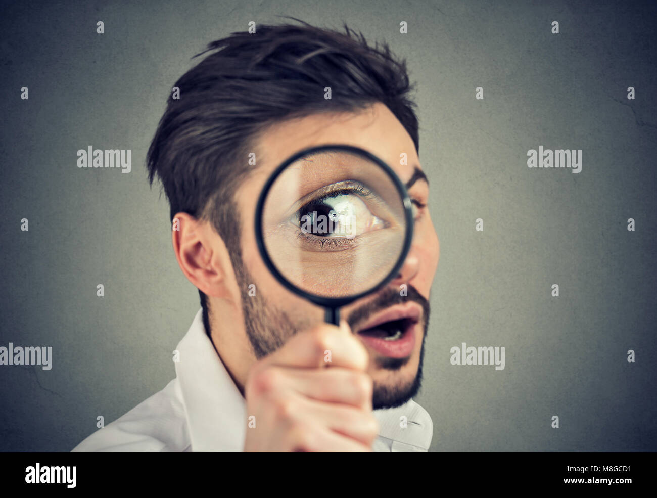 Looking Through A Magnifying Glass Stock Photos & Looking Through A ...