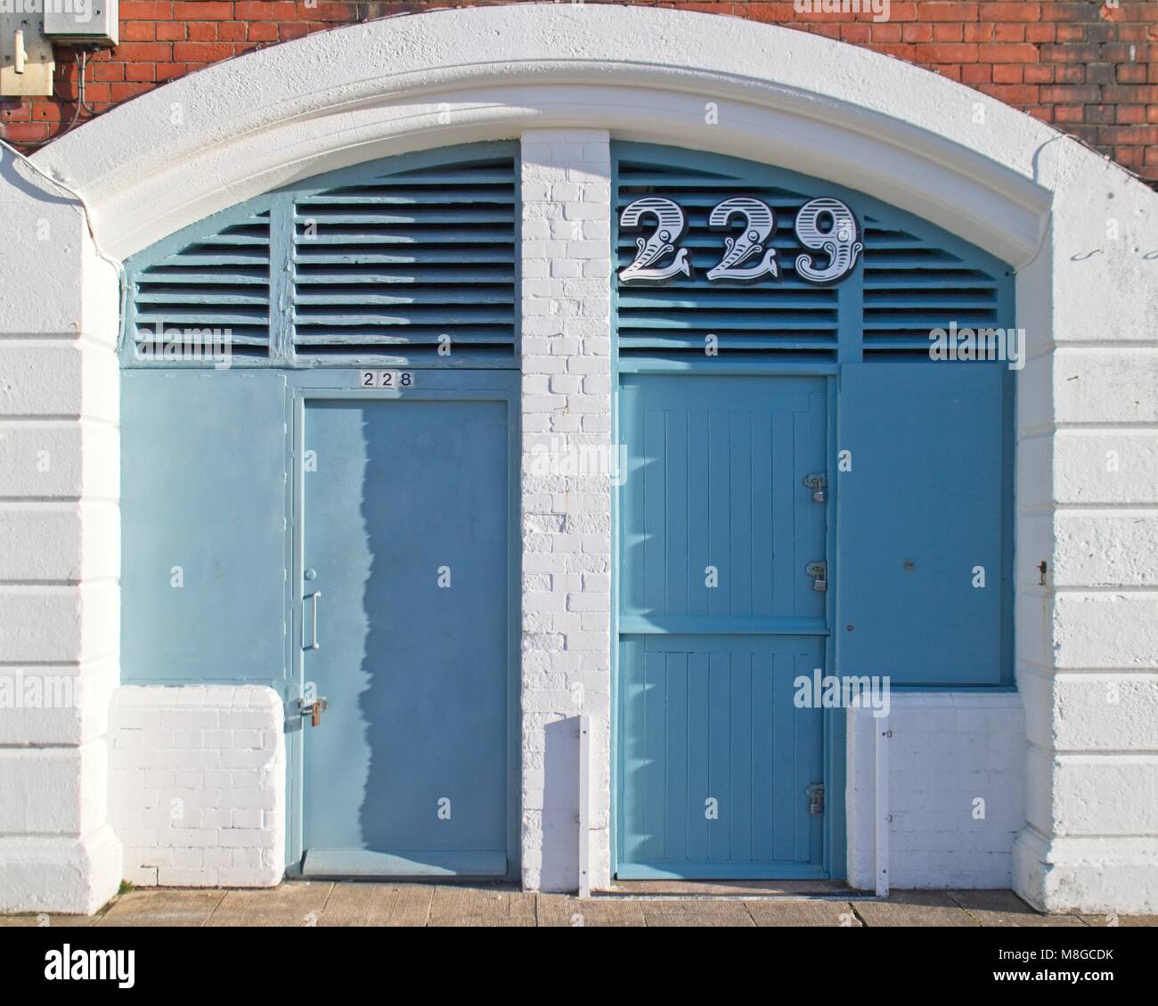 Blue doors with white stone surround at promenade Brighton seafront ...