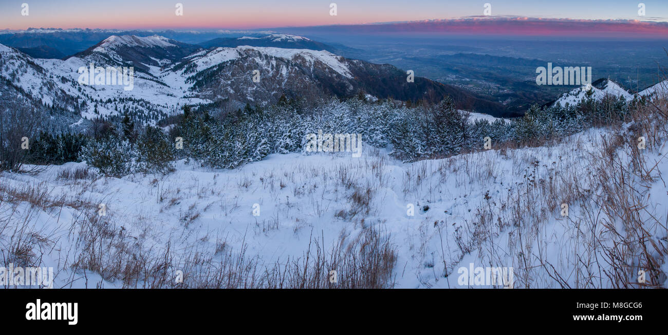 Majestic alpenglow paints mountains and clouds at sunset, looking down ...