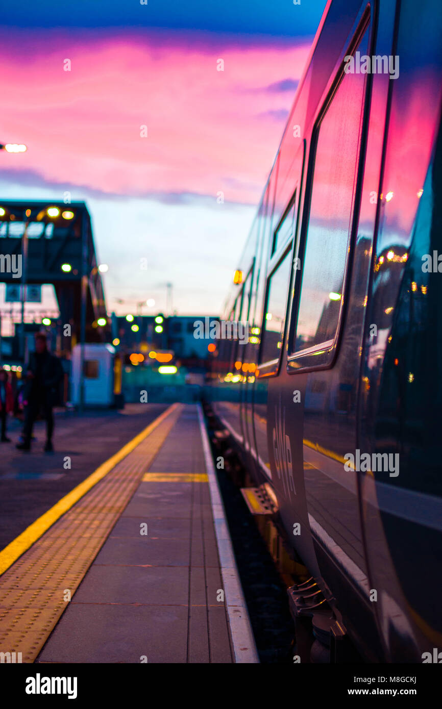 Train with purple sky background Stock Photo - Alamy