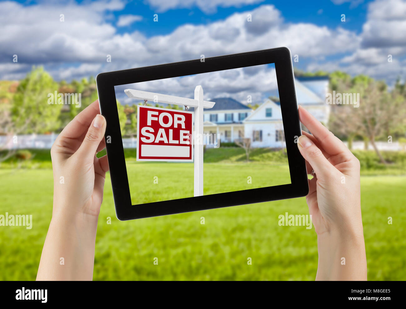 Female Hands Holding Computer Tablet with Home For Sale Sign on Screen ...