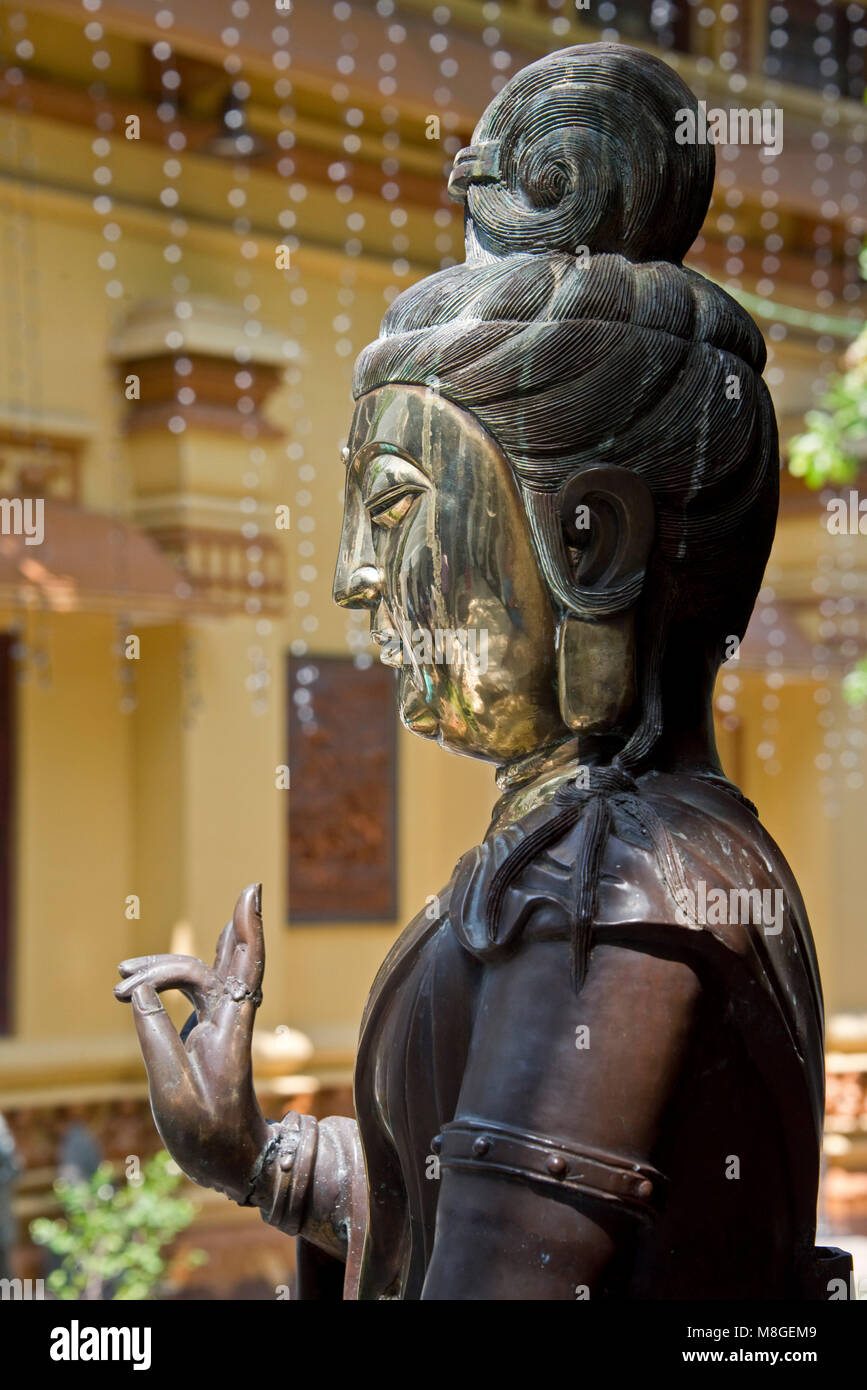 Close up of a bronze Bhudda statue at the Gangaramaya (Vihara) Buddhist ...