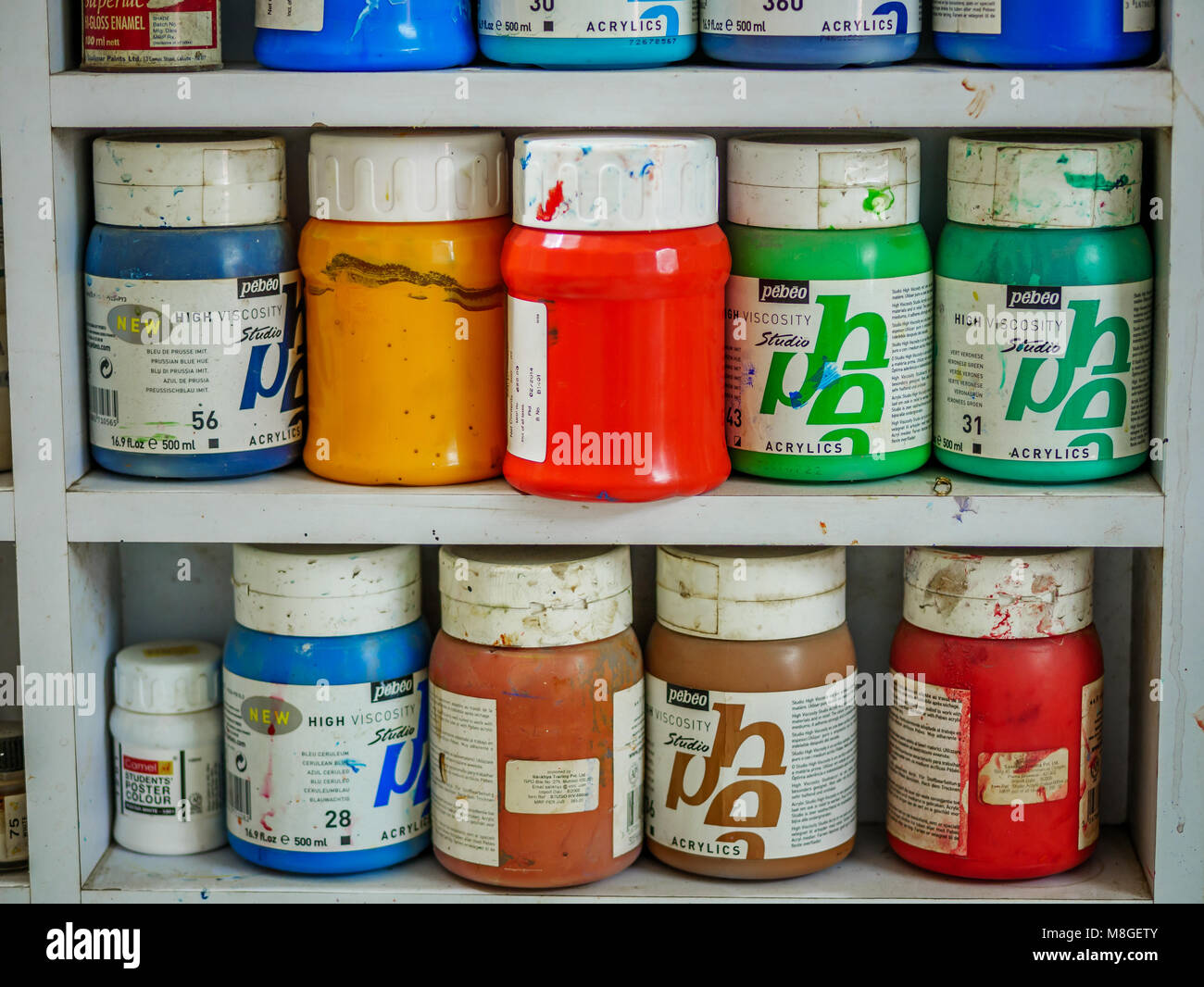 Mumbai, India – March 9, 2018: Various colourful dye in containers in ...