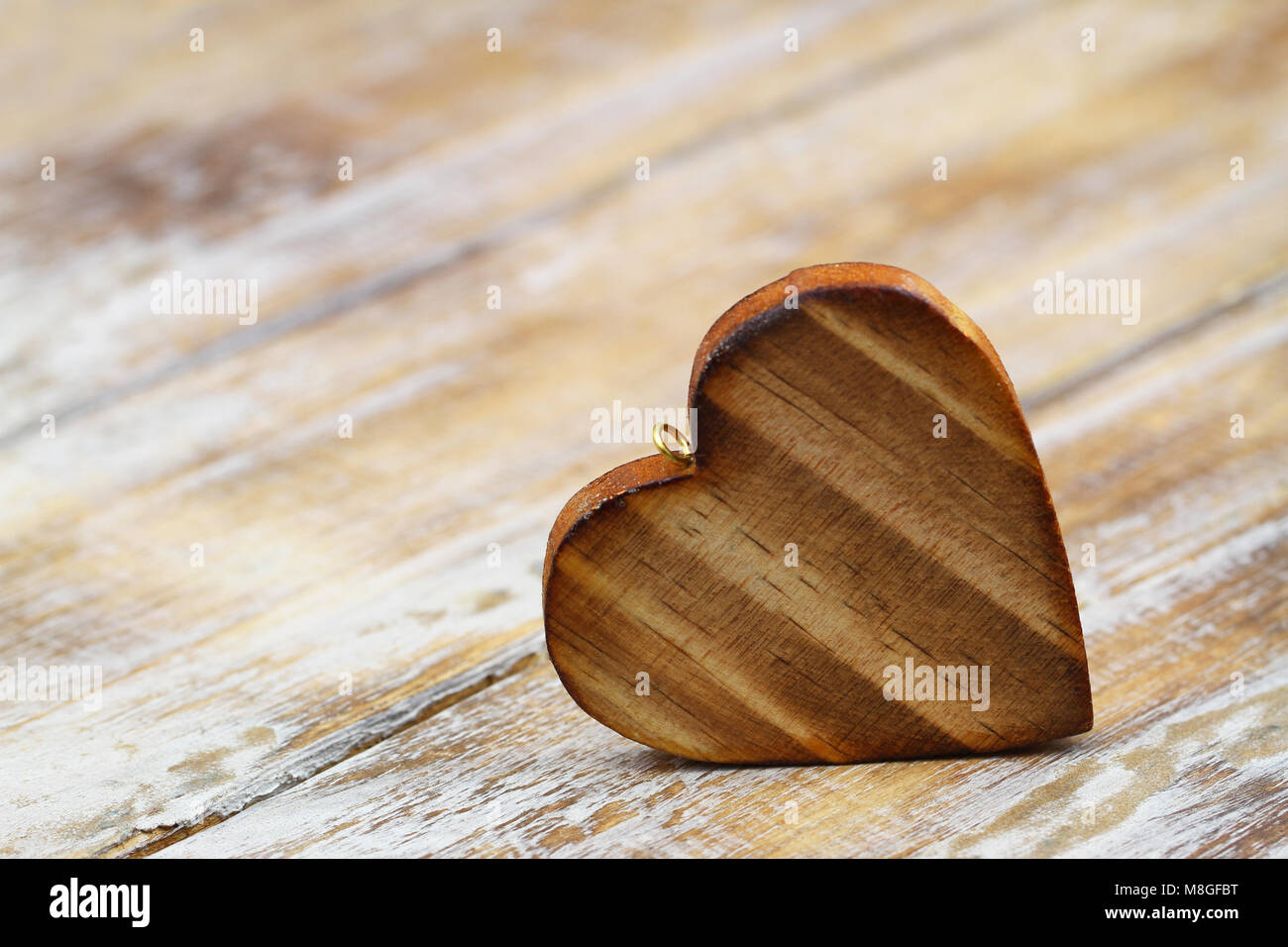 Brown wooden heart on rustic surface with copy space Stock Photo - Alamy