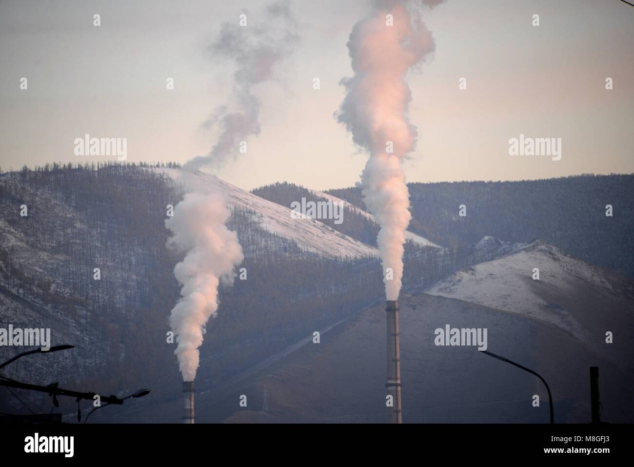 Smoke rises from factory chimneys in Ulaanbaatar. Extreme winter ...