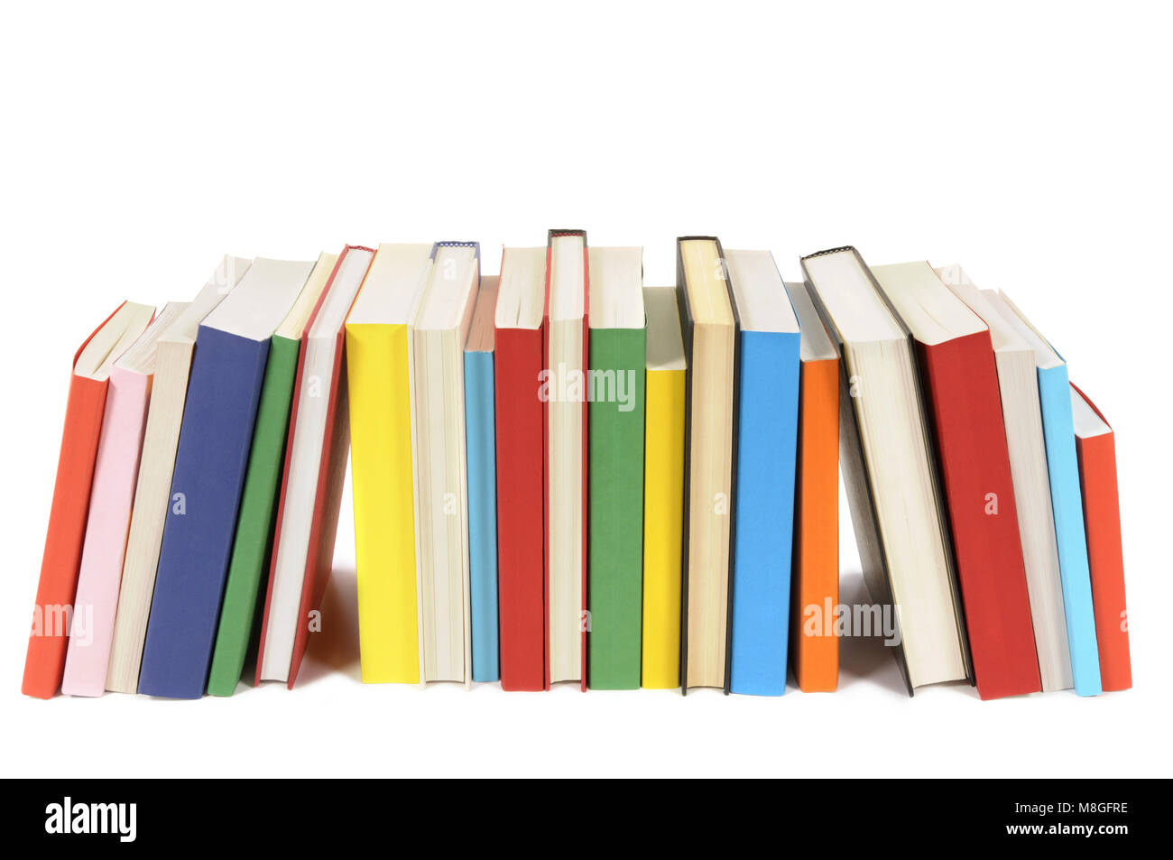 Row of colorful books isolated on a white background. Space for copy ...