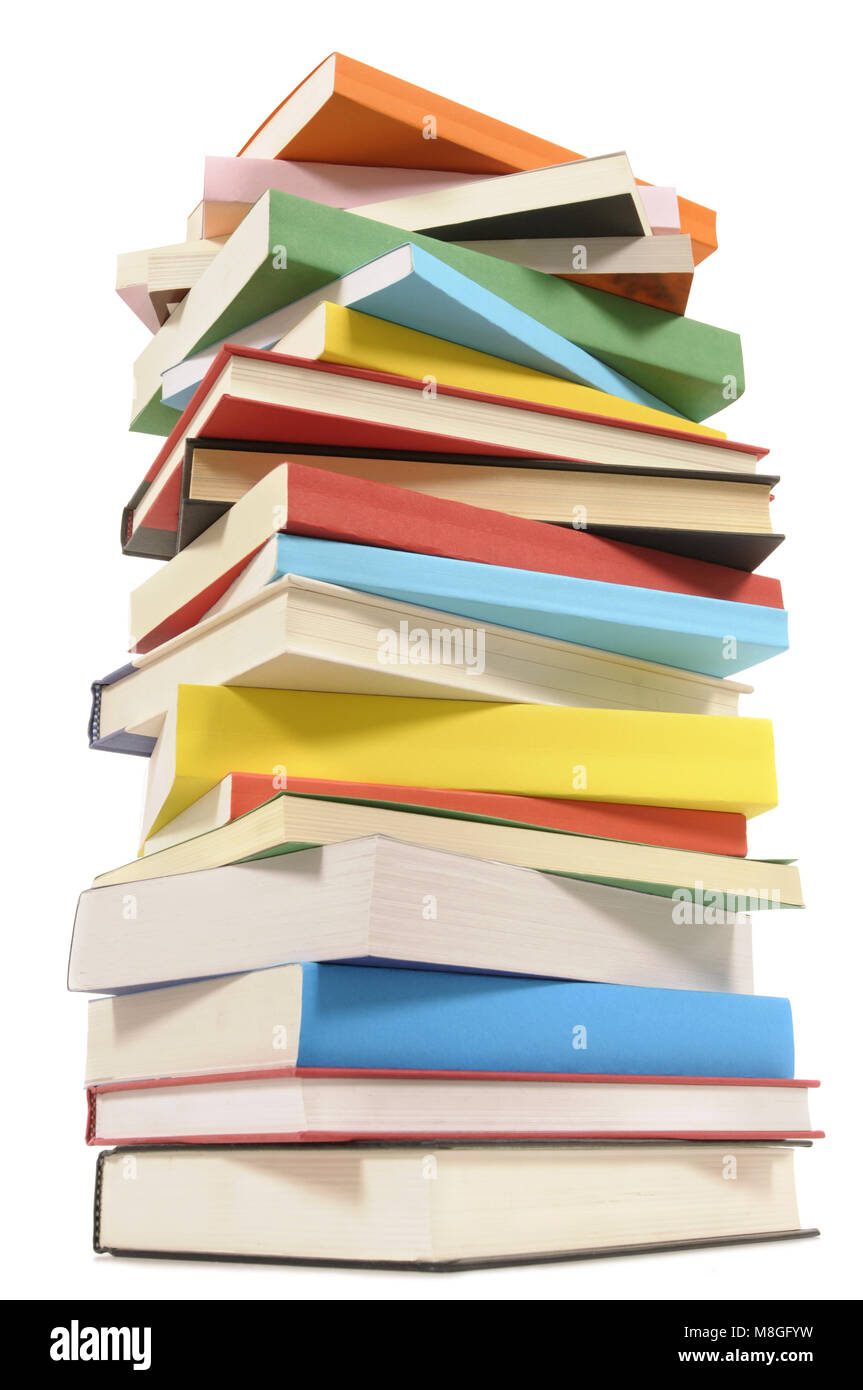 Very tall untidy stack or pile of colorful books isolated on a white ...