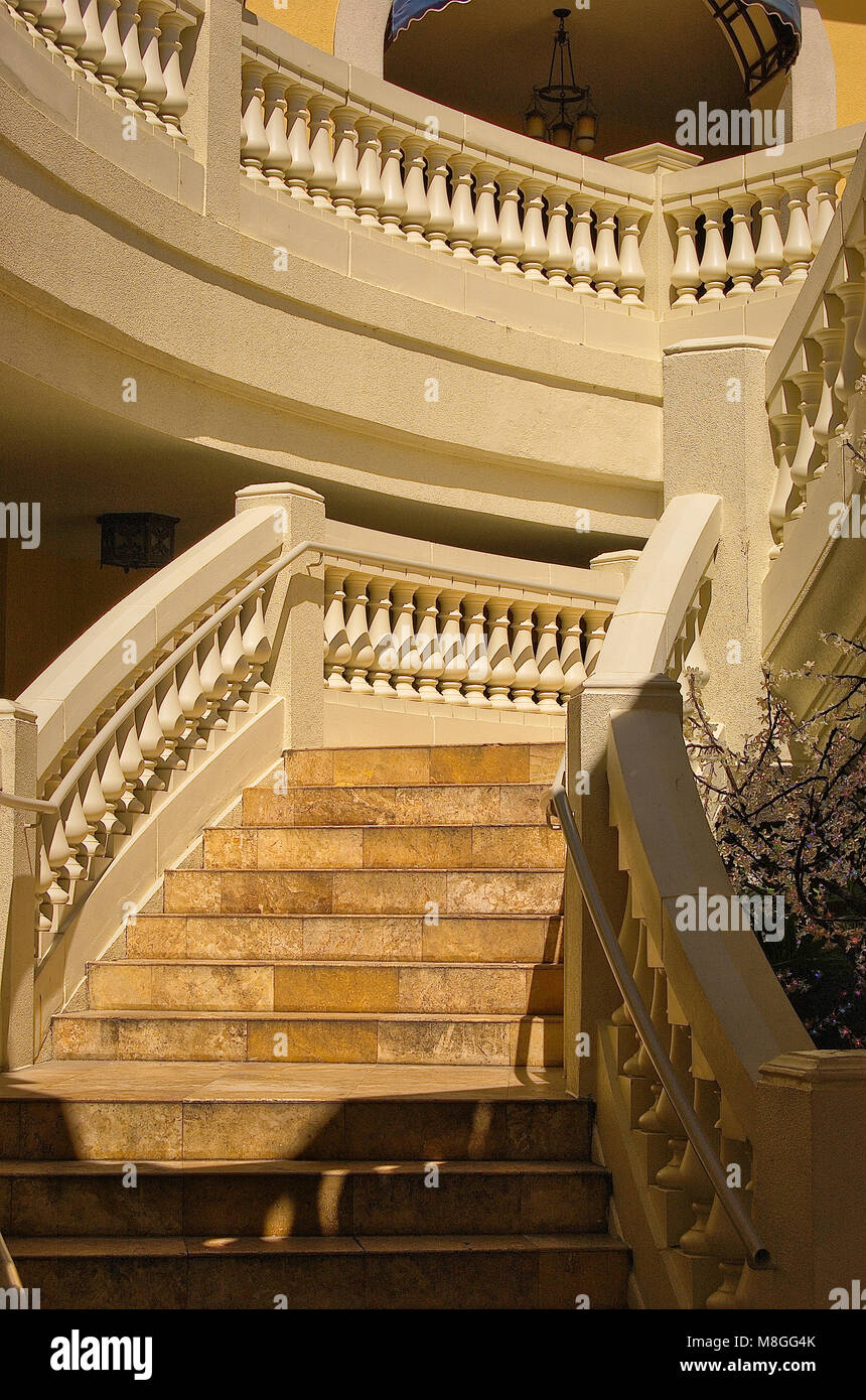 Curving stairway and balcony with cement rails and columns Stock Photo ...