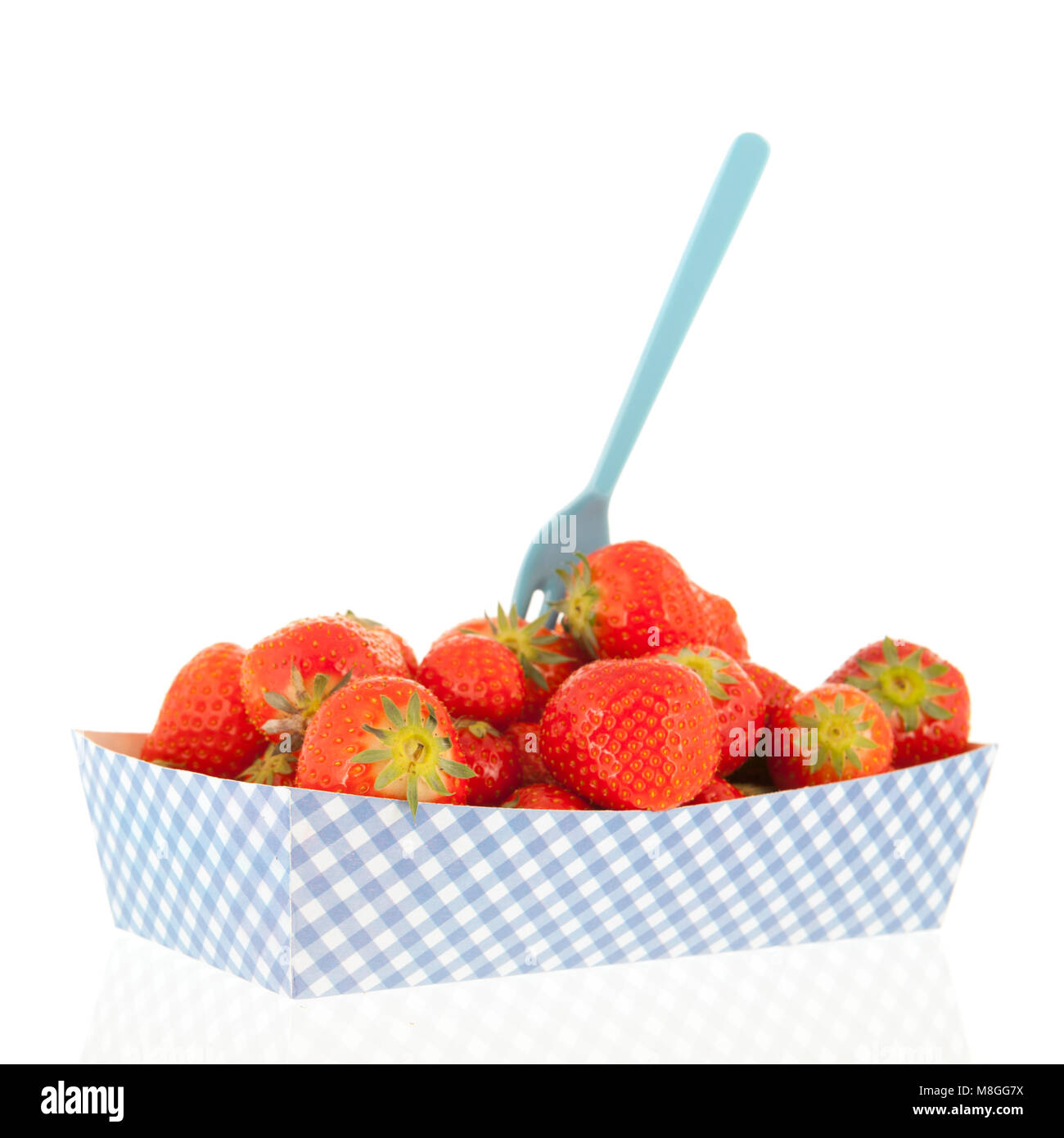 Blue snack box with fresh strawberries isolated over white background ...