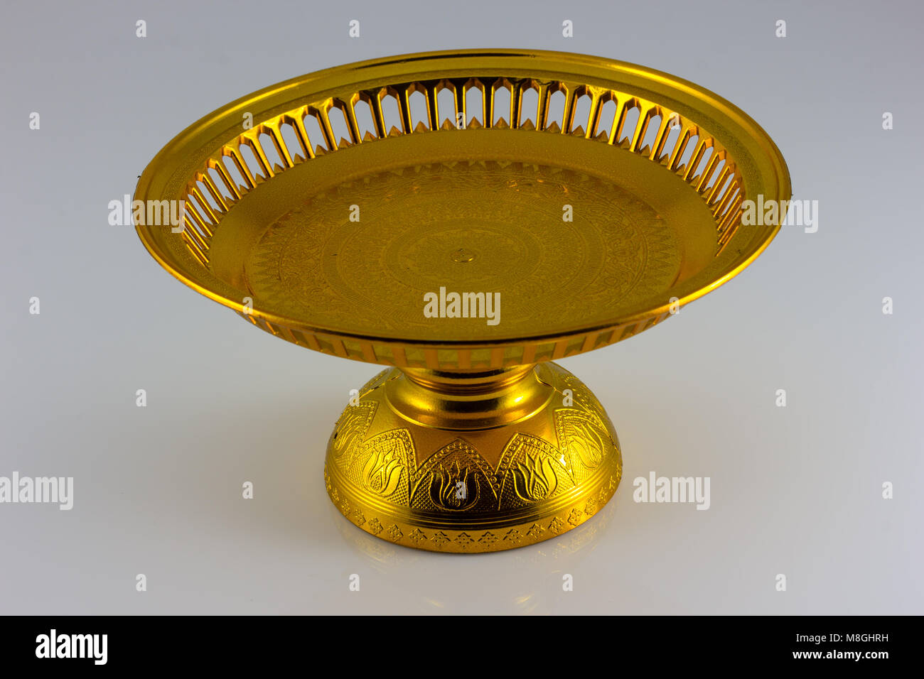 golden ware isolate in white background Stock Photo - Alamy