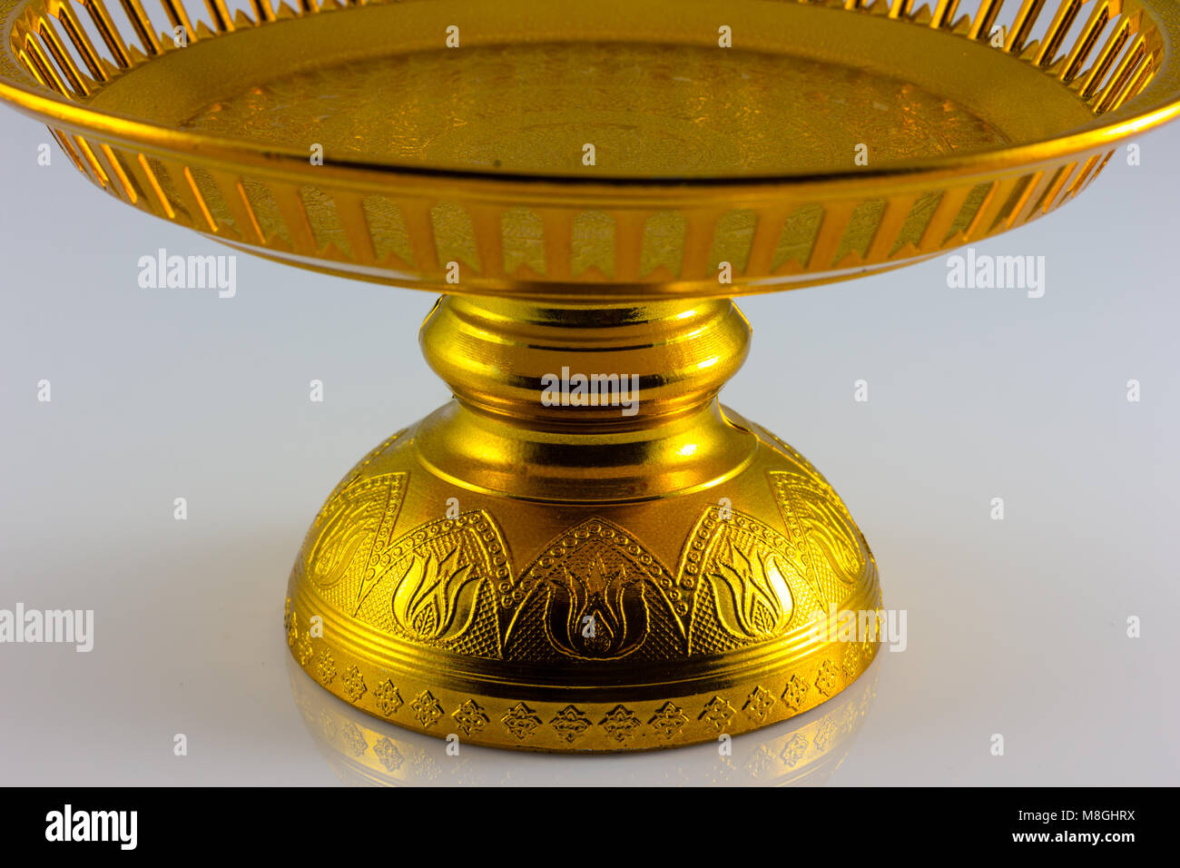 golden ware isolate in white background Stock Photo - Alamy