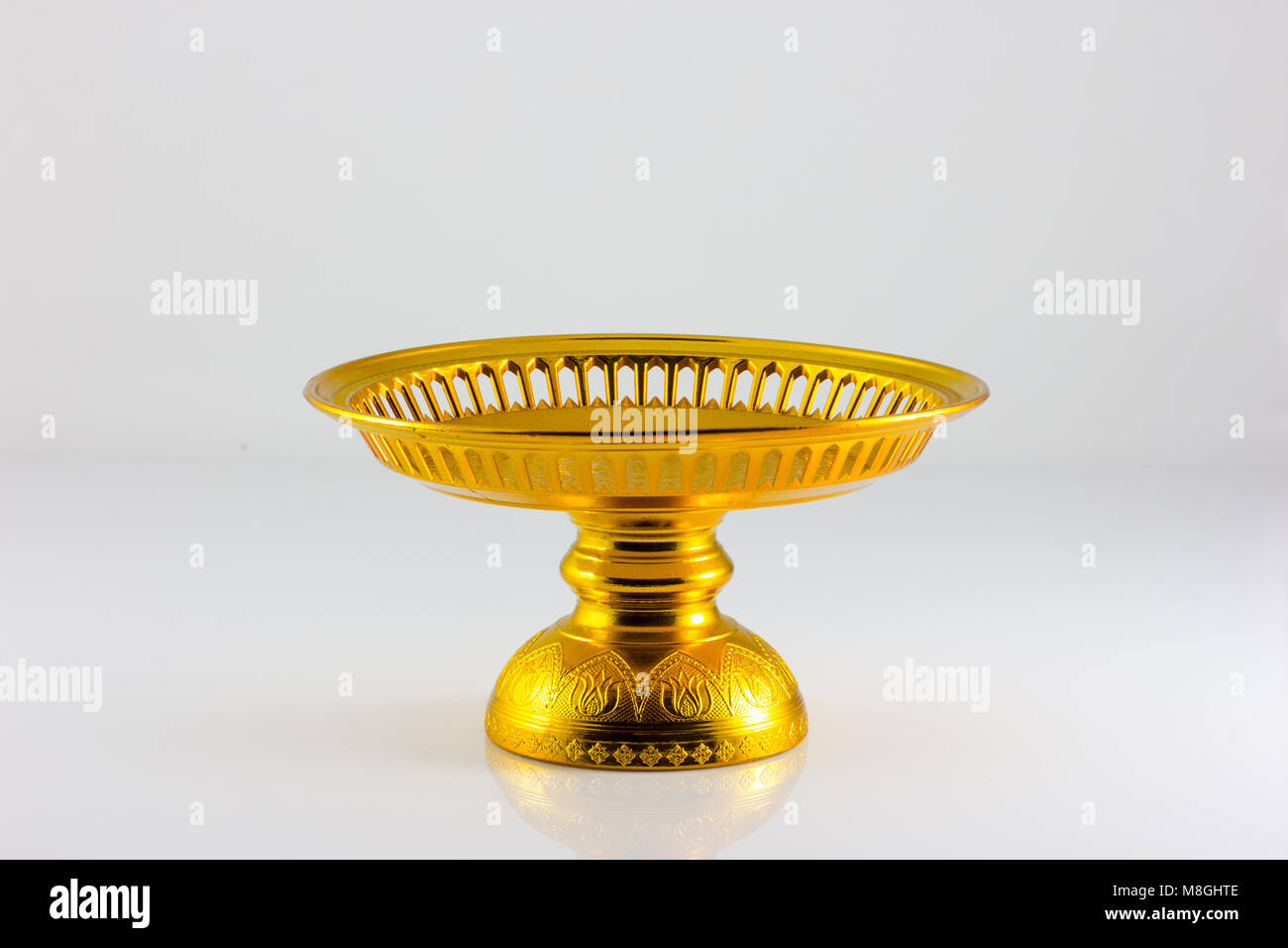golden ware isolate in white background Stock Photo - Alamy