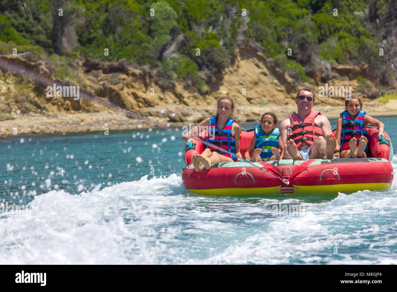 Family water sport adventure on the sea Stock Photo - Alamy