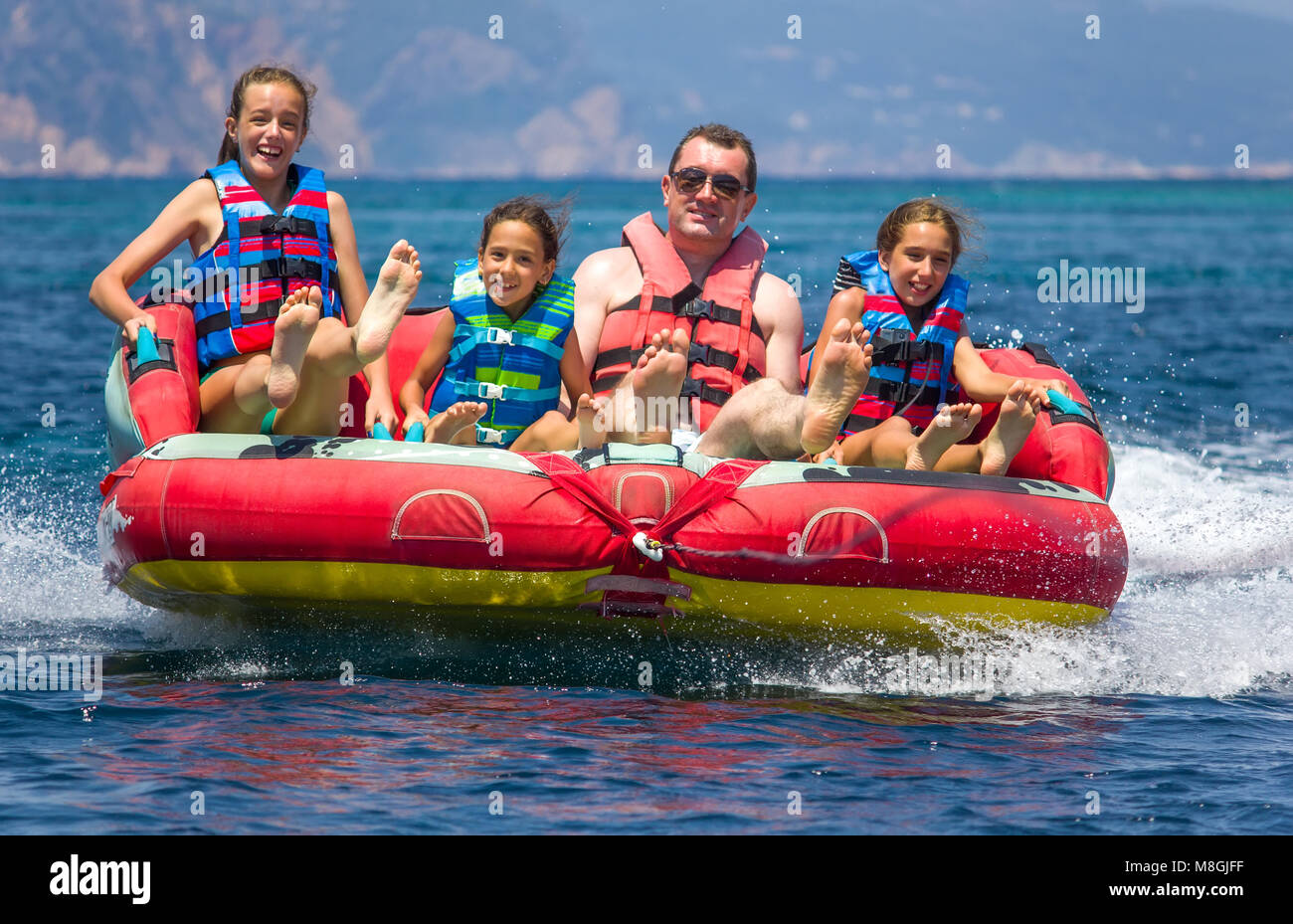 Family water sport adventure on the sea Stock Photo - Alamy