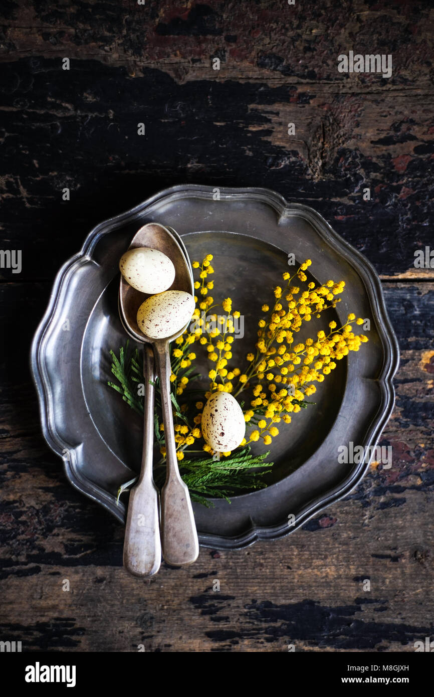 Spring table setting with bright yellow mimosa flowers Stock Photo - Alamy
