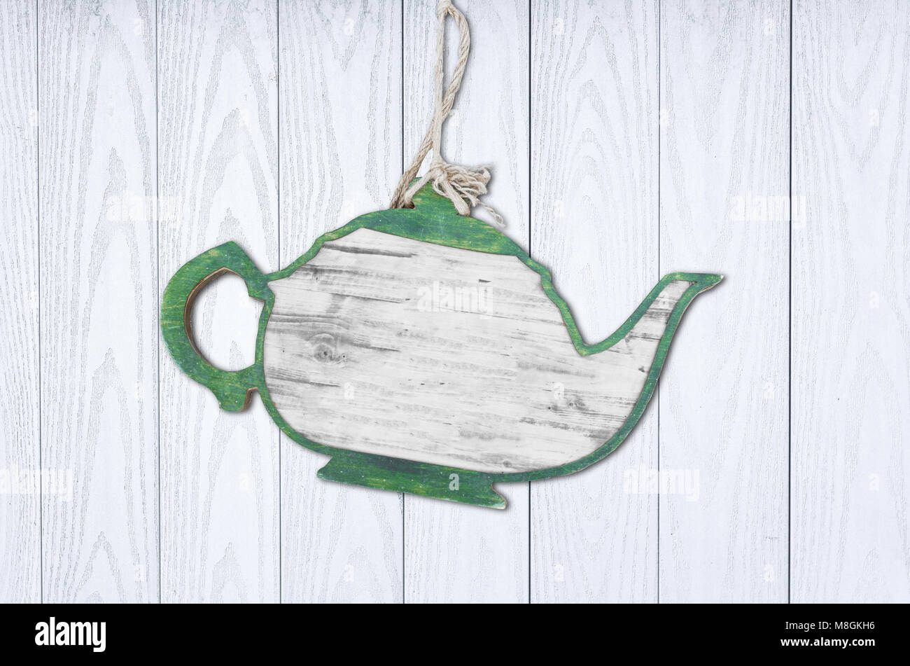 Tea time, signboard and teapot - lie on white table background. Empty ...