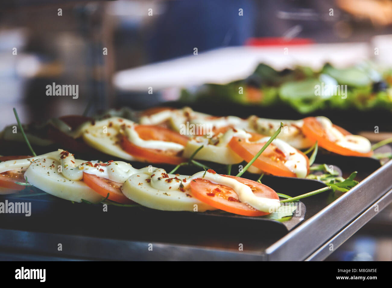 sandwich topping, sliced tomatoes and cheese decorated with spices and ...