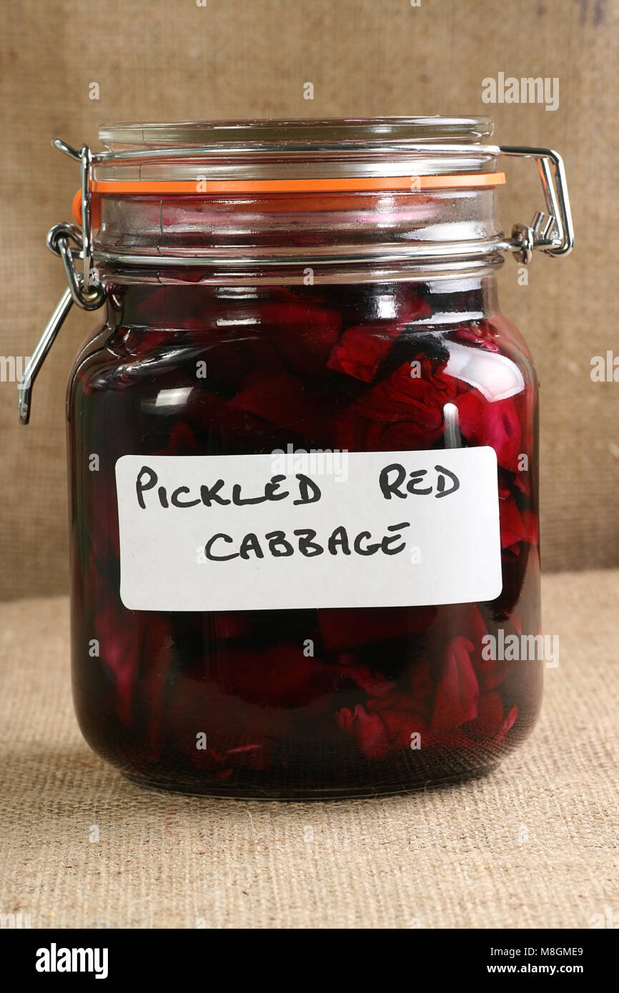 jar of pickled red cabbage on a rustic hessian background Stock Photo ...