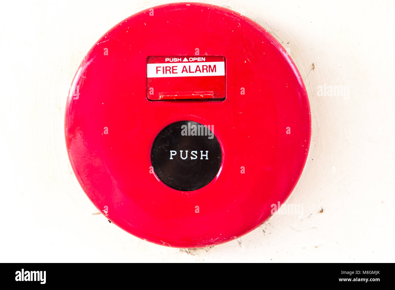 Dirty fire alarm on the wall of the building Stock Photo - Alamy