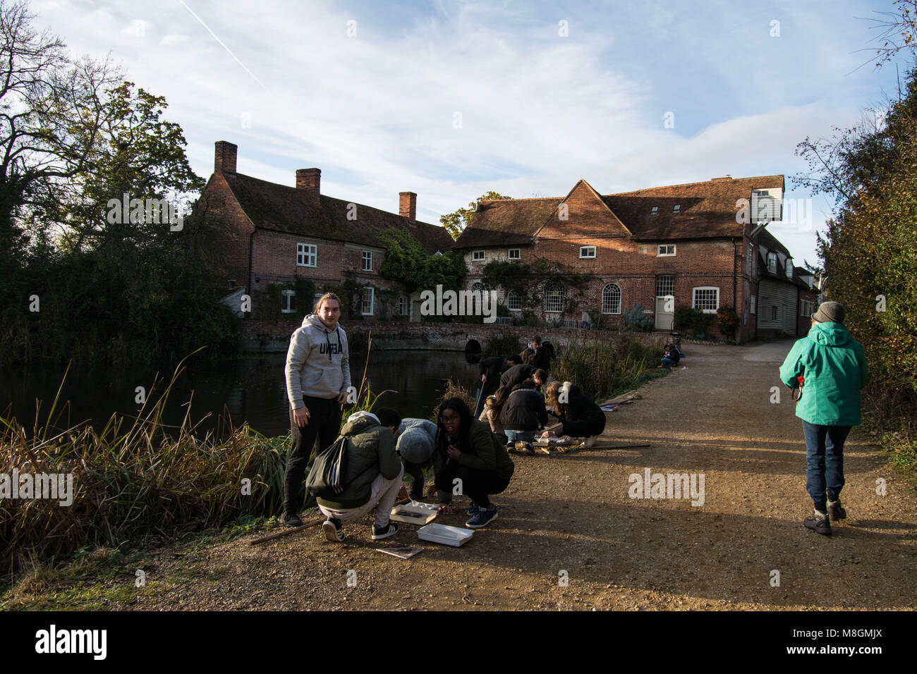 Children with teacher fishing at Flatford Mill Suffolk England UK ...