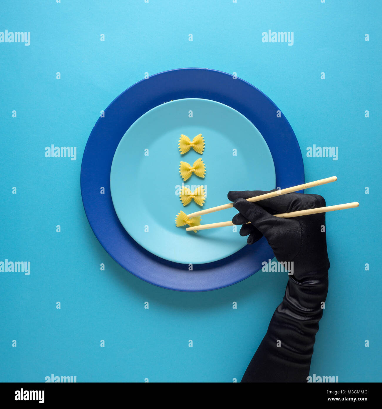 Creative concept photo of kitchenware with hand, painted plate with ...