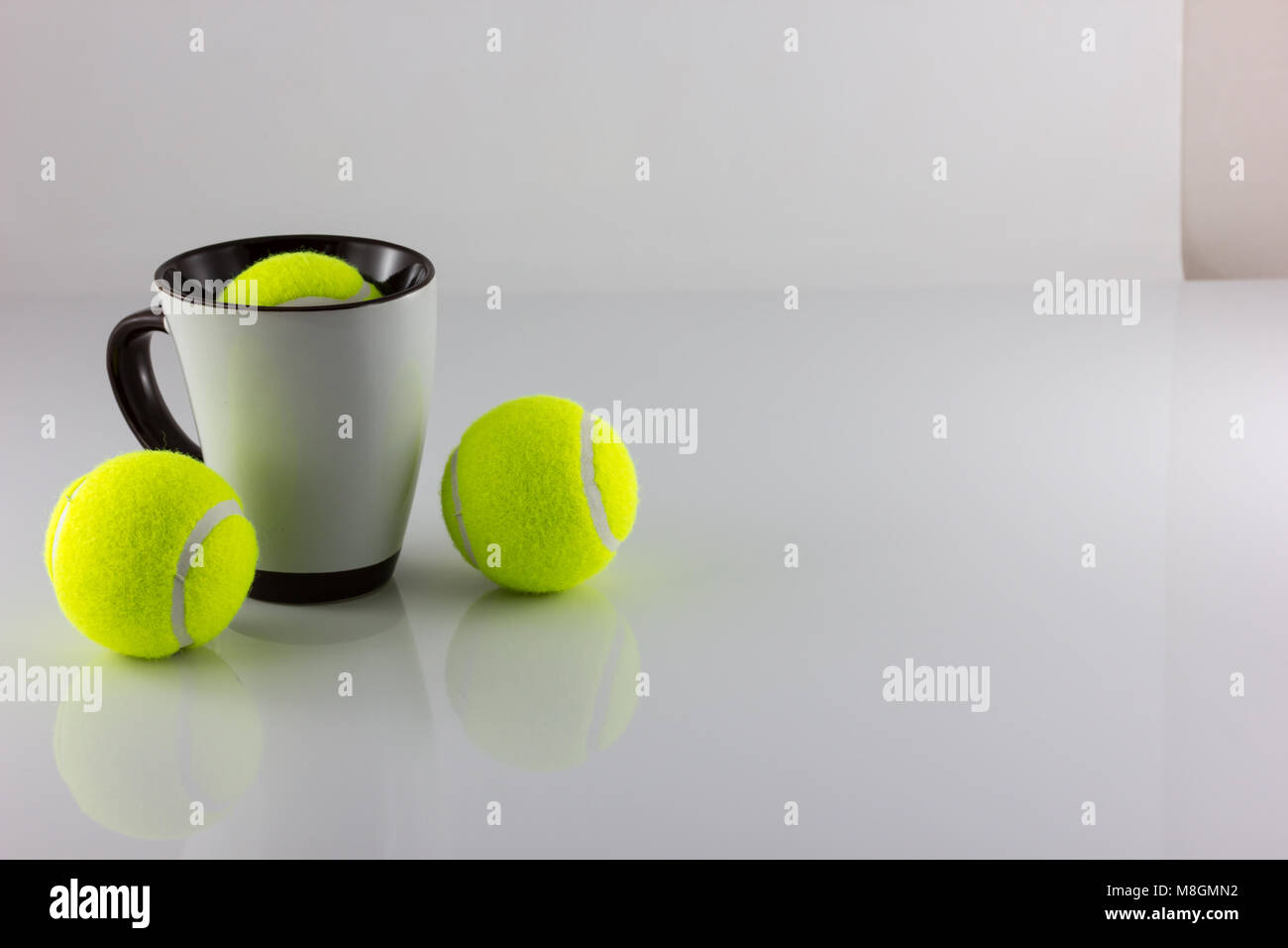 Tennis balls and Cofee cup isolate on white background Stock Photo - Alamy