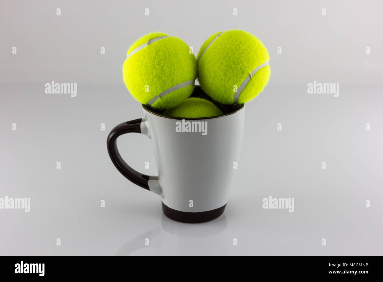 Tennis balls and Cofee cup isolate on white background Stock Photo - Alamy