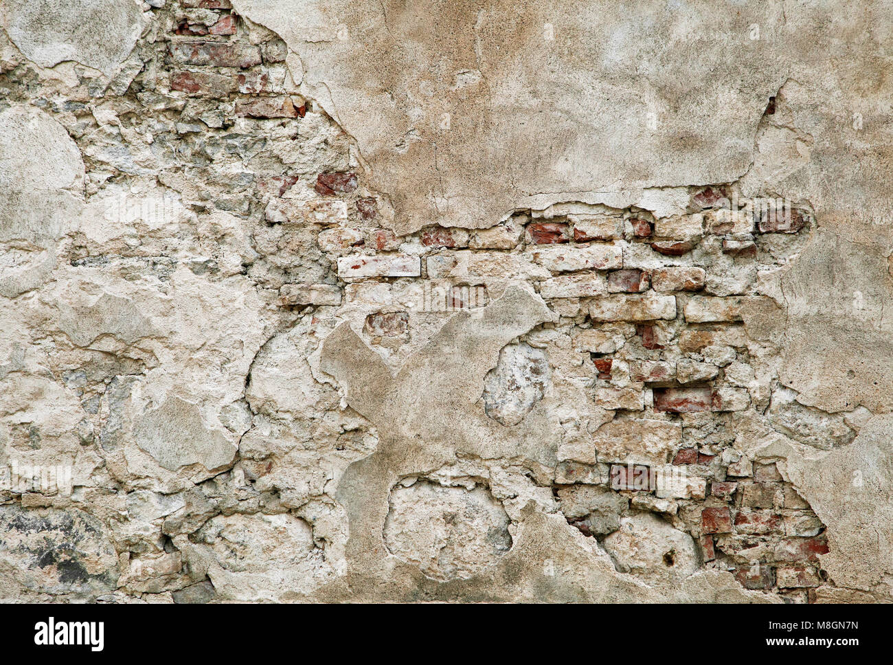 Old wall with brickwork under plaster Stock Photo - Alamy