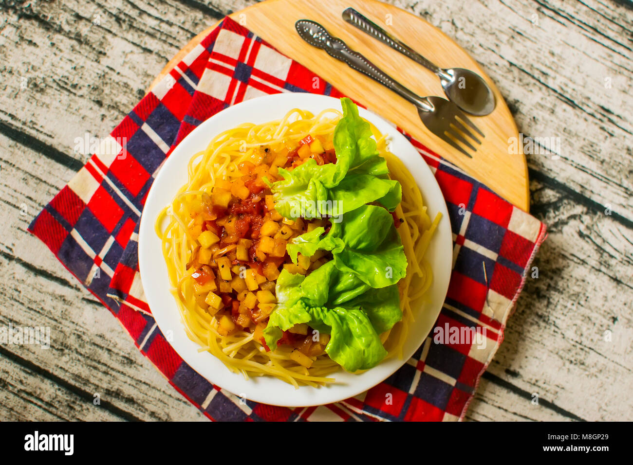 Spaghetti pasta on wood background Stock Photo - Alamy