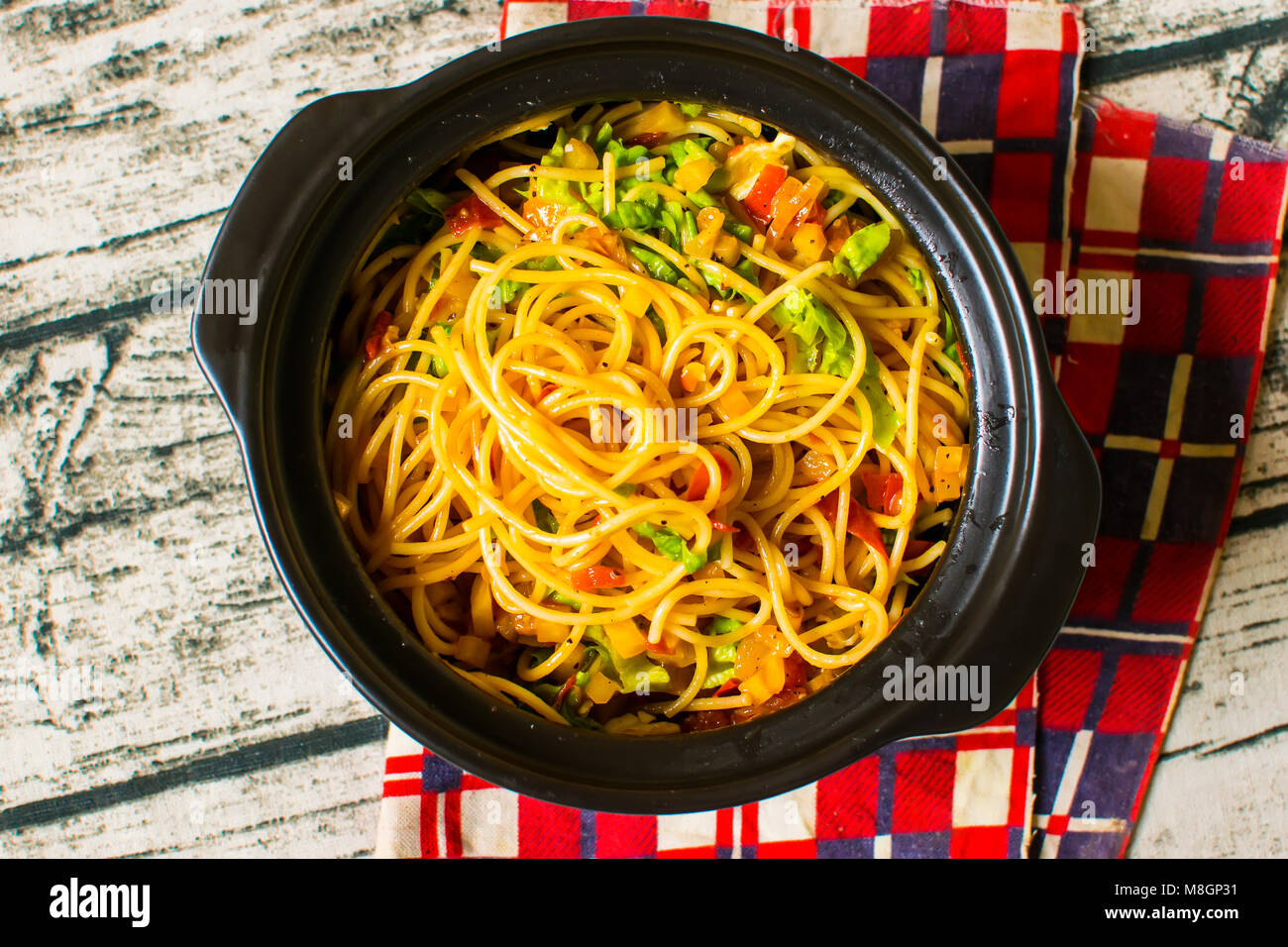 Spaghetti pasta on wood background Stock Photo - Alamy