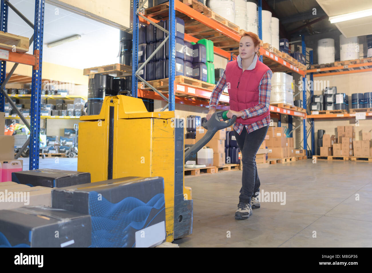 Woman picking up boxes hi-res stock photography and images - Alamy