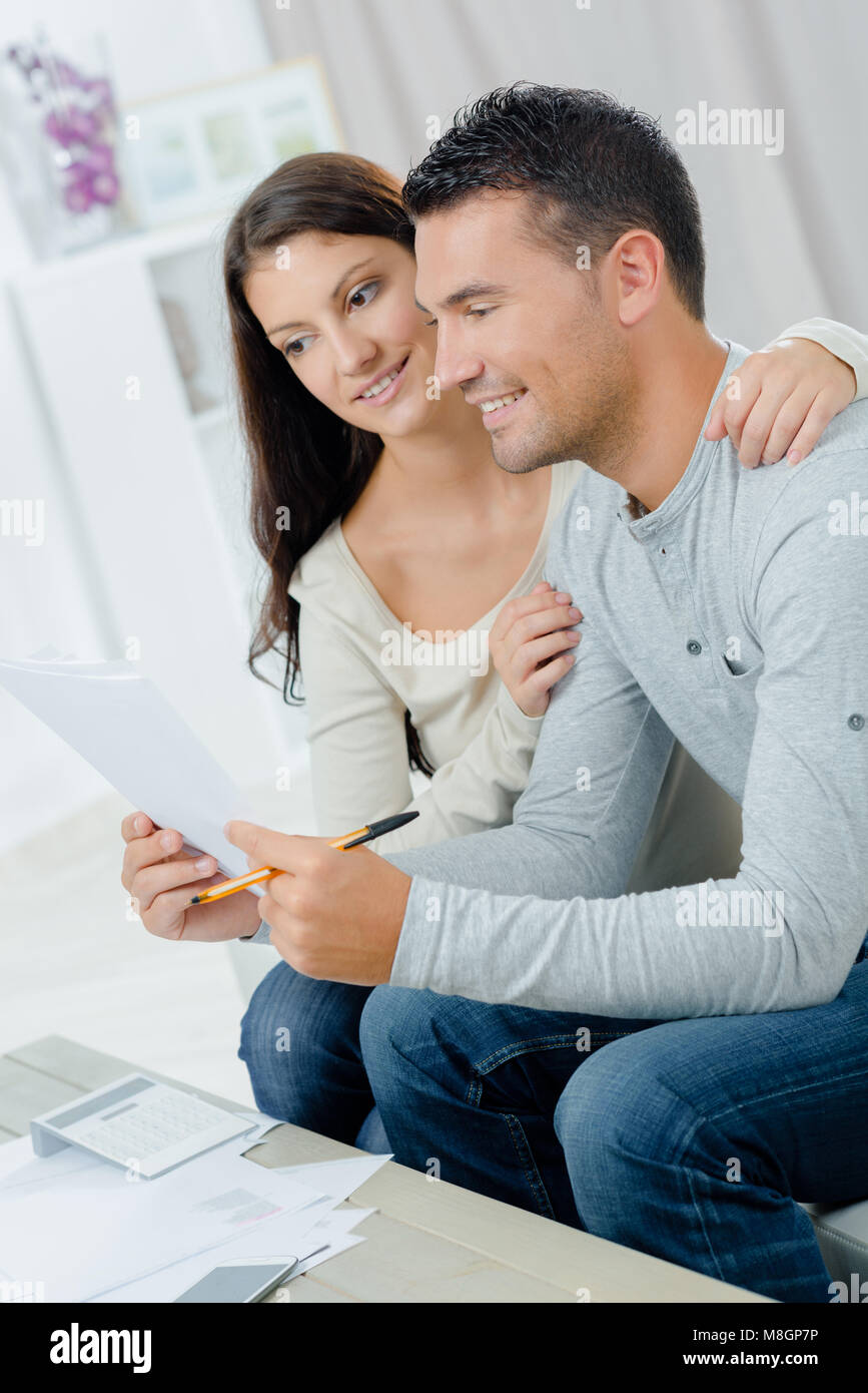 Couple smile calculator hi-res stock photography and images - Alamy