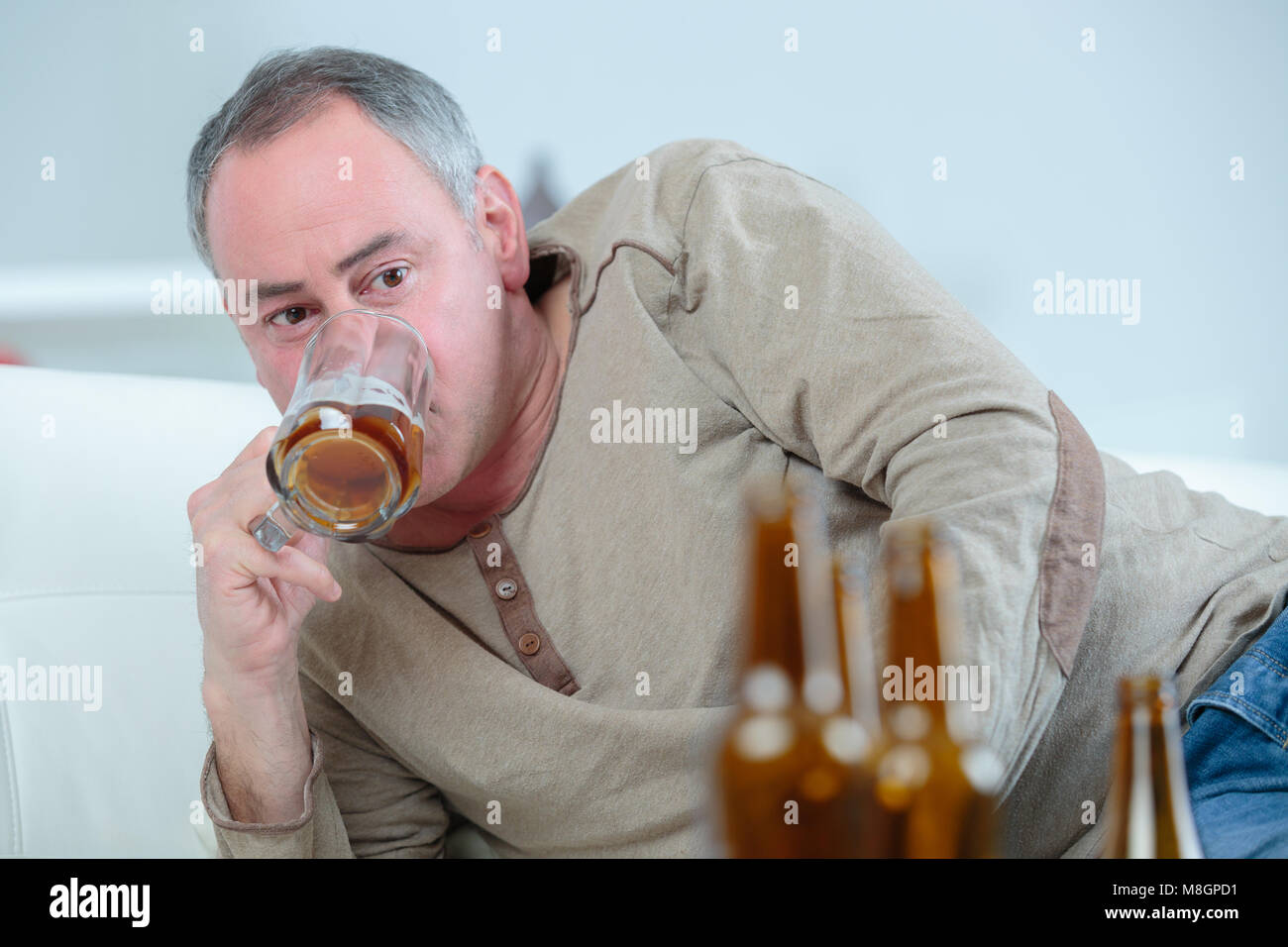 alcoholic man drinking alcohol Stock Photo - Alamy