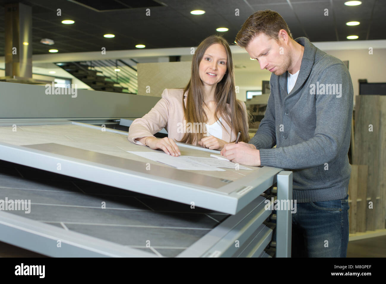 couple reading a contract document Stock Photo - Alamy