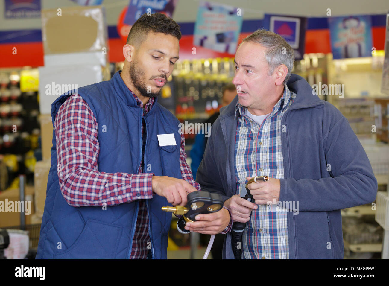 hardware store vendor and customer Stock Photo - Alamy