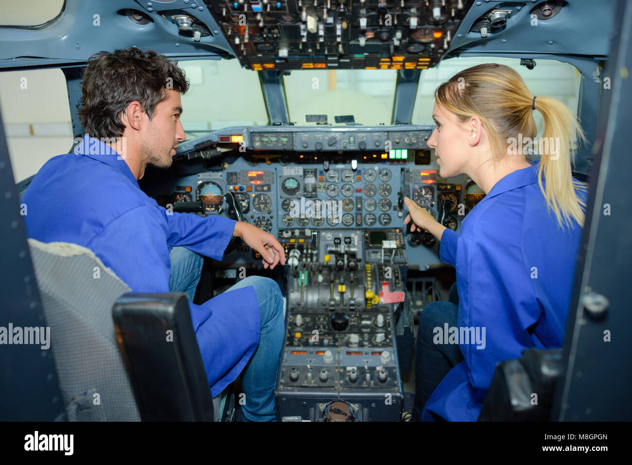 aircraft technicians in the cabin Stock Photo - Alamy