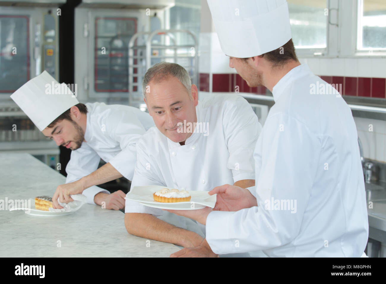 head chef with apprentices Stock Photo - Alamy