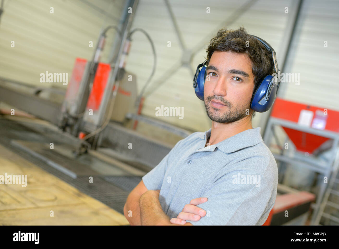 Portrait of man wearing earmuffs Stock Photo - Alamy