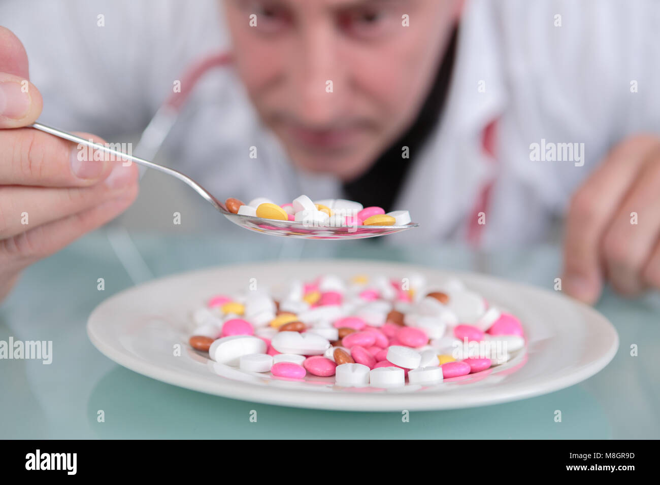a plateful of pills Stock Photo - Alamy