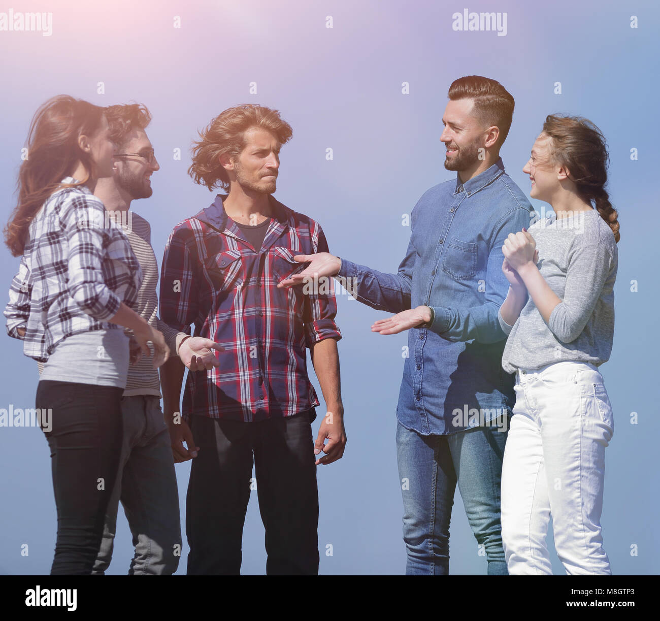 group of students talking while standing outdoors Stock Photo - Alamy