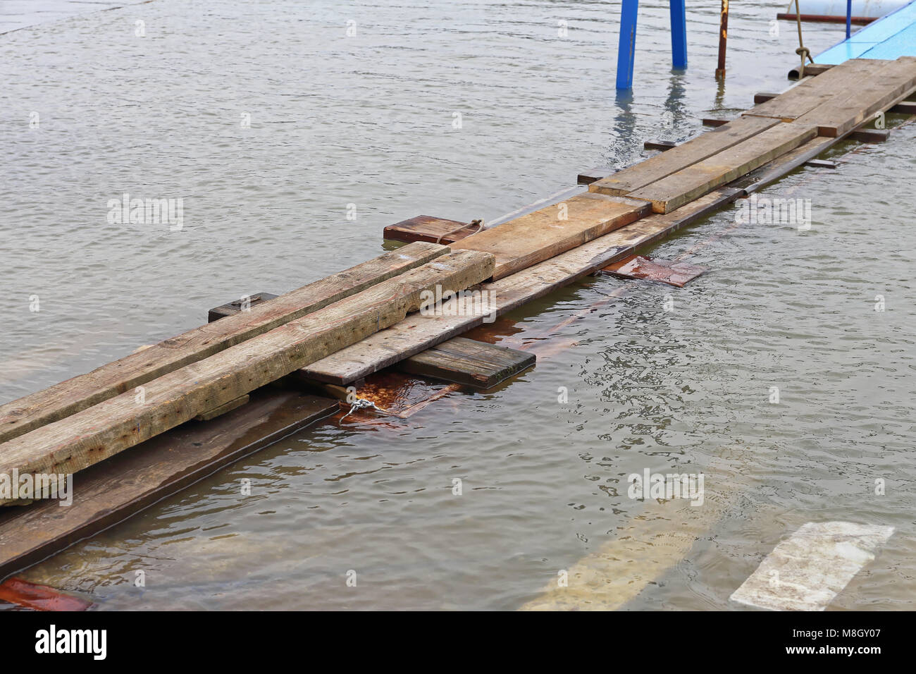 Floating Plank Boards Bridge Over Flood Water Stock Photo - Alamy