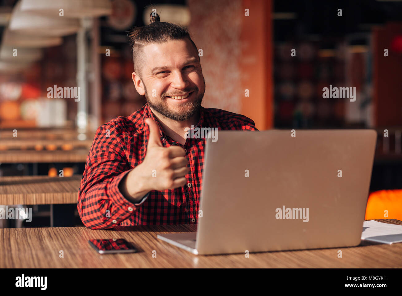 Portrait of happy it developer showing finger up Stock Photo - Alamy