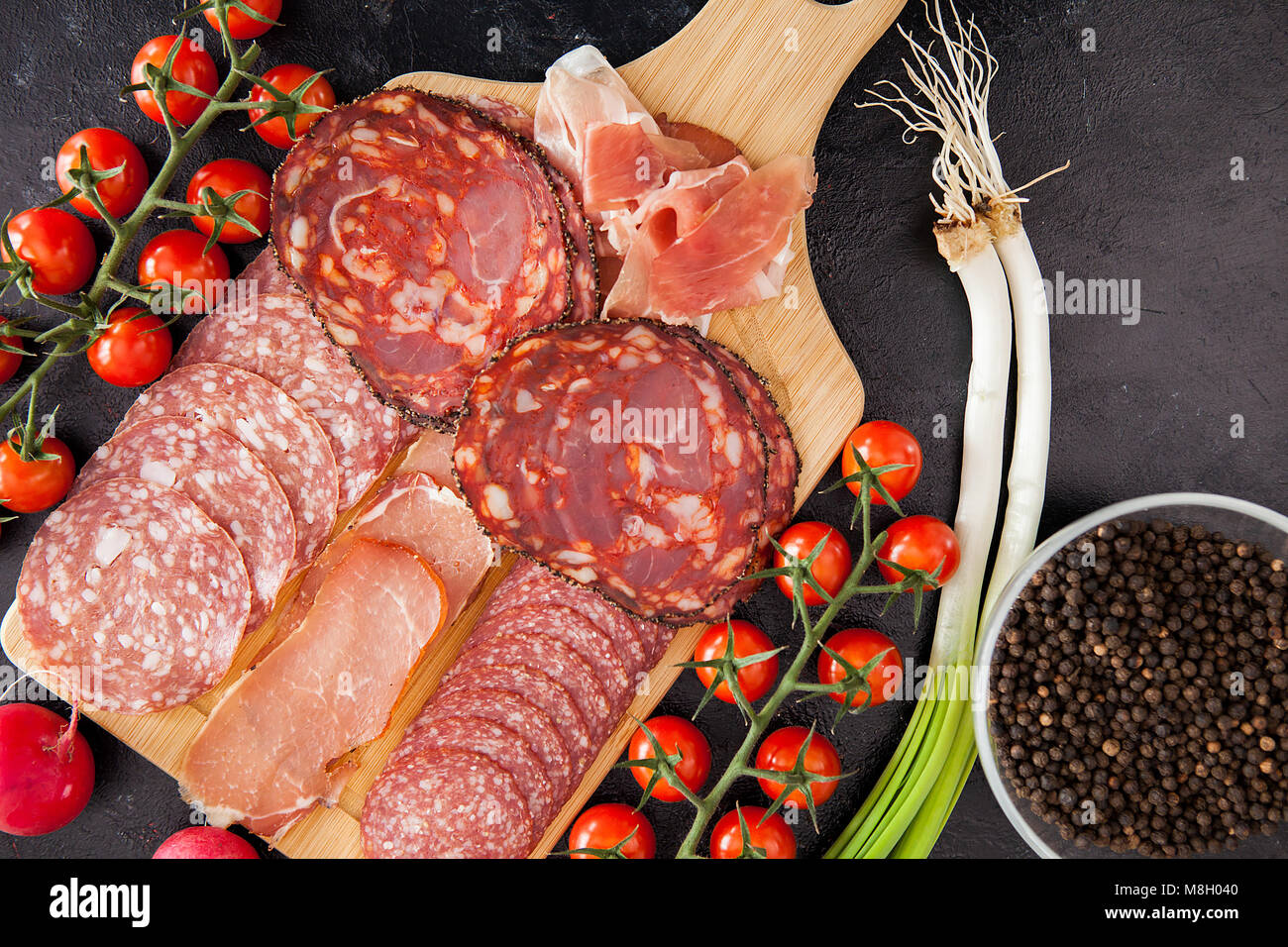 Top view on different types of sliced ham, proscuitto and salami Stock ...