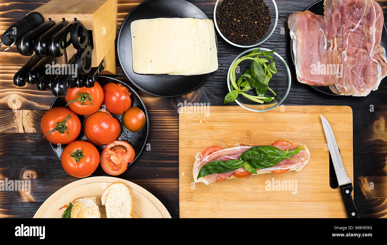Making sandwiches at the kitchen Stock Photo - Alamy